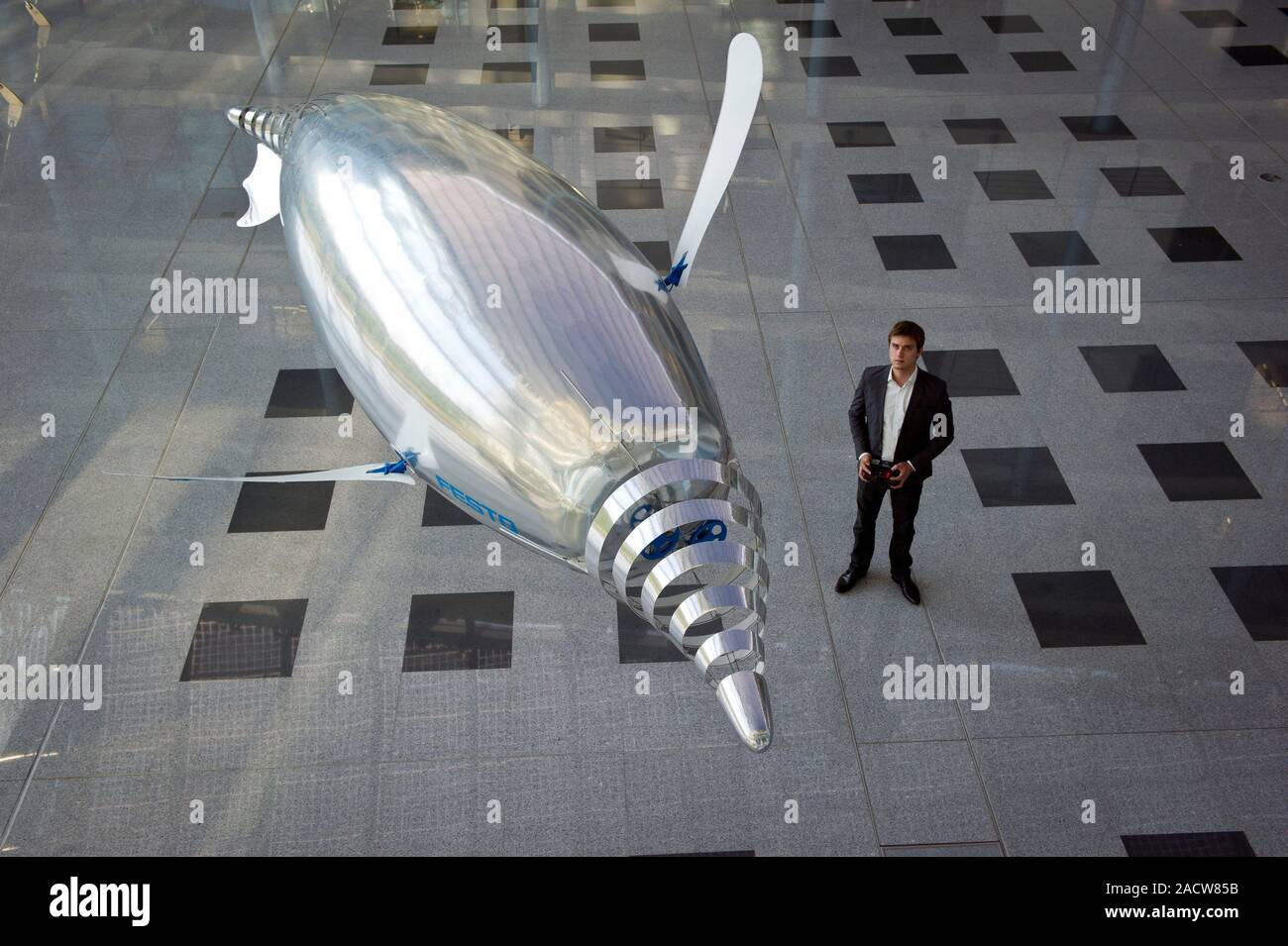 FESTO AirPenguin. Man controlling a remote controlled AirPenguin in an ...