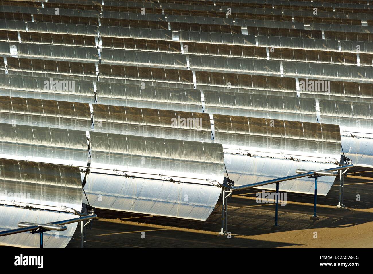 Parabolic trough solar power plant. Parabolic mirror array at the ...