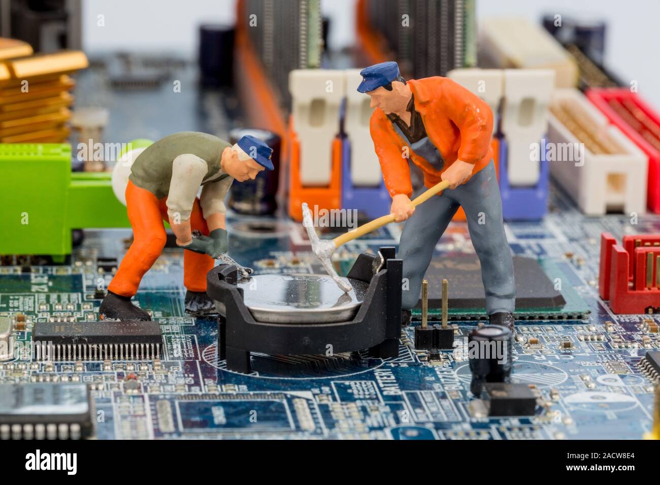 Computer board and construction worker Stock Photo - Alamy