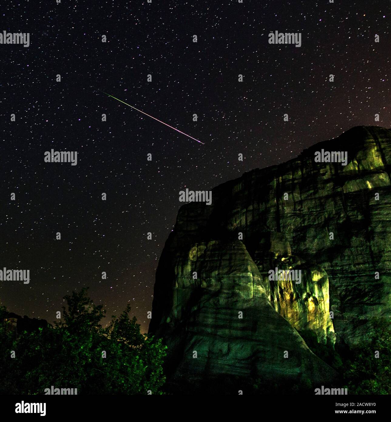 Perseid meteor track in the night sky over Meteora, Greece. The ...