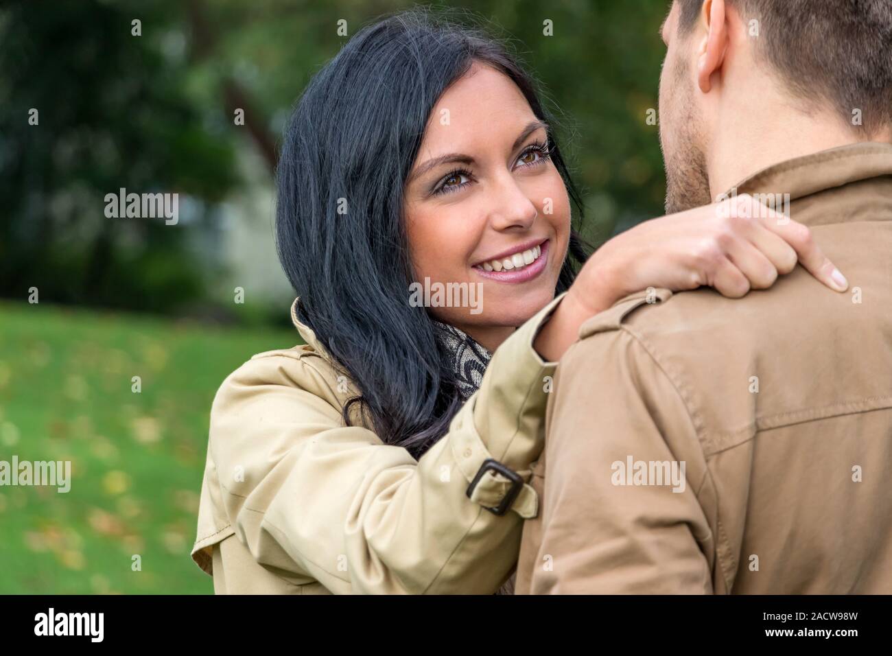 Couple in love in a park Stock Photo - Alamy