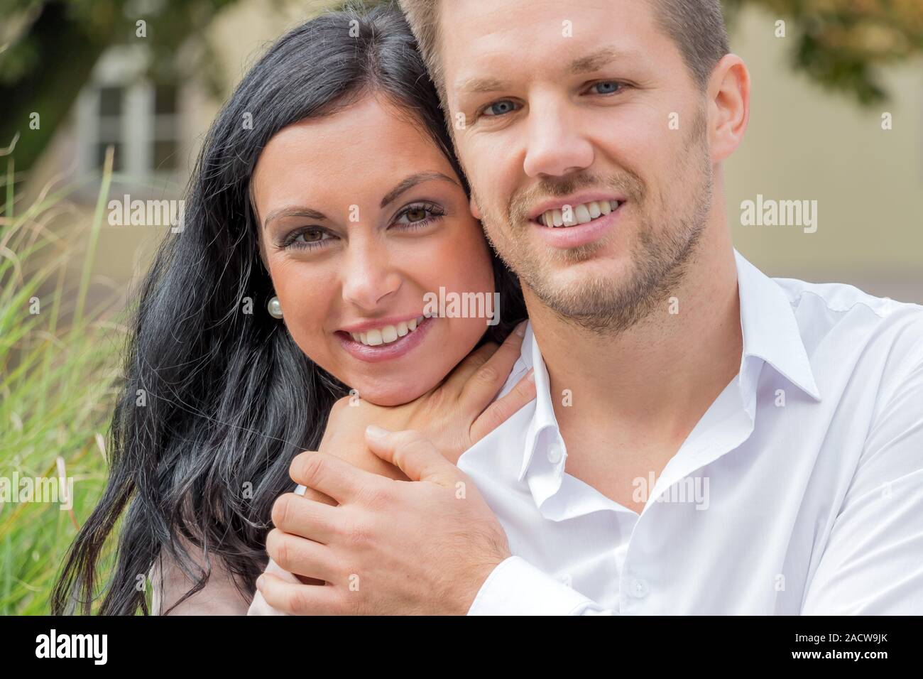 Couple in love in a park Stock Photo - Alamy