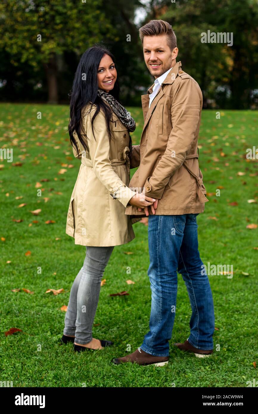 Couple in love in a park Stock Photo - Alamy