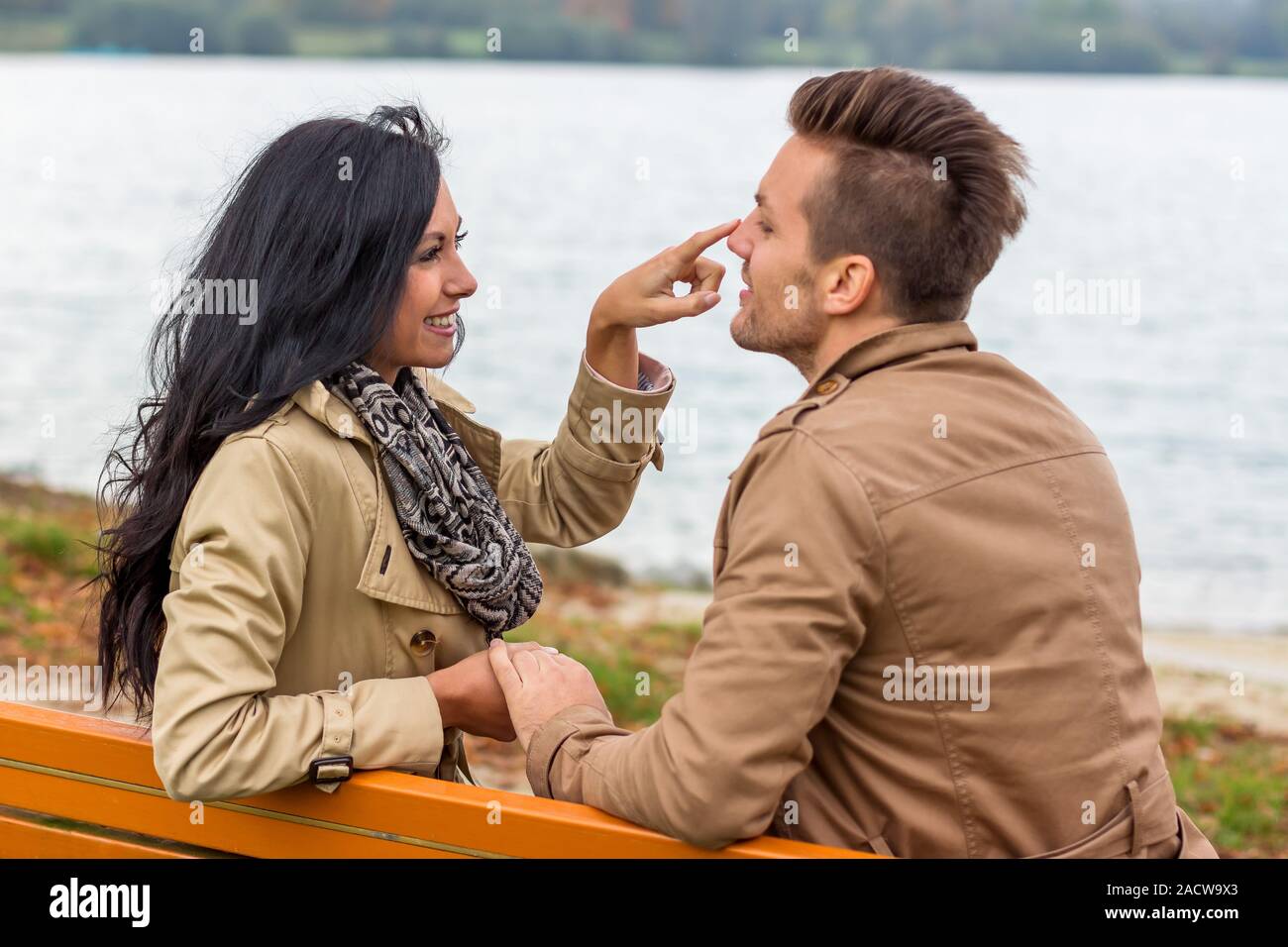 Couple in love on a park bench Stock Photo - Alamy