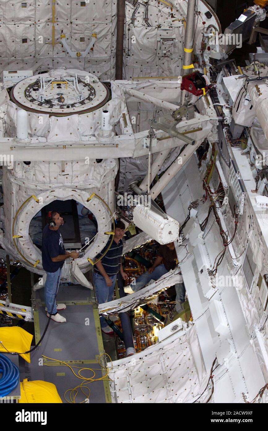 Fuel cell being removed from Space Shuttle Atlantis' payload bay in ...