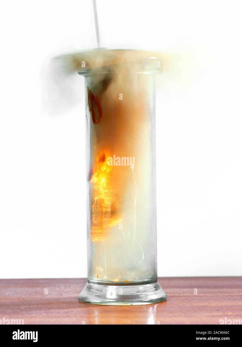 Iron-chlorine reaction. Iron (Fe) producing flames as it reacts with ...