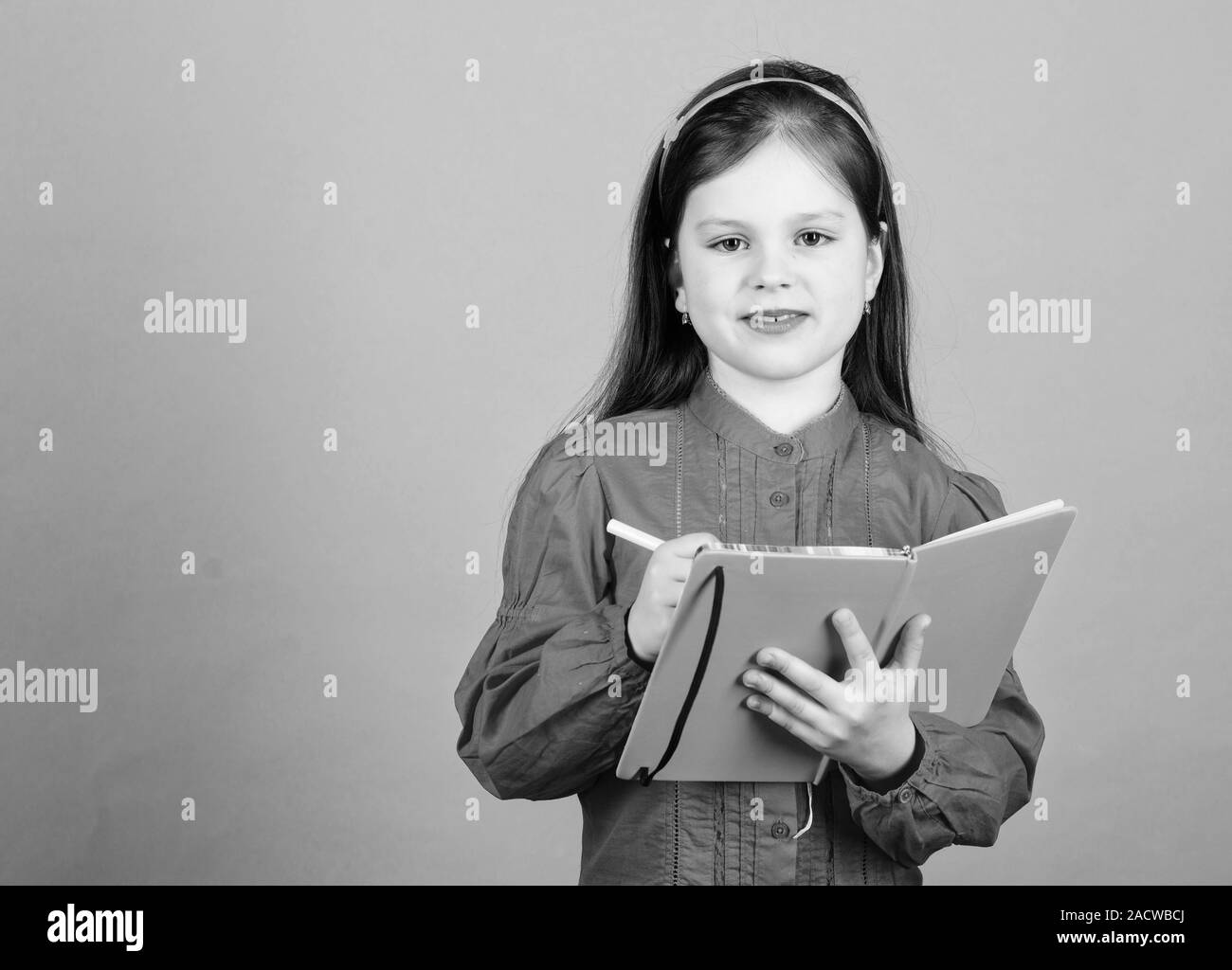 Collecting survey information. Little girl writing notice of ...