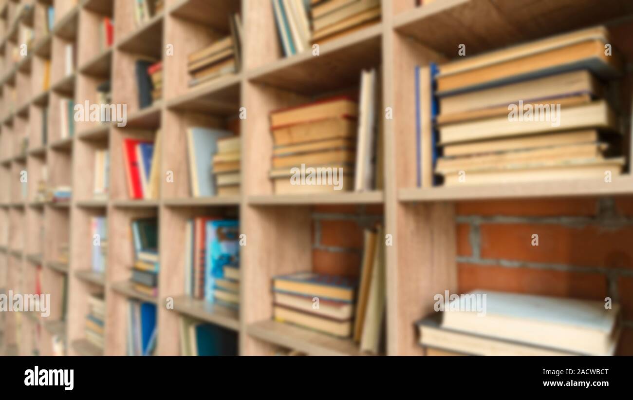 Book background. Blurred background with books on library shelves Stock ...