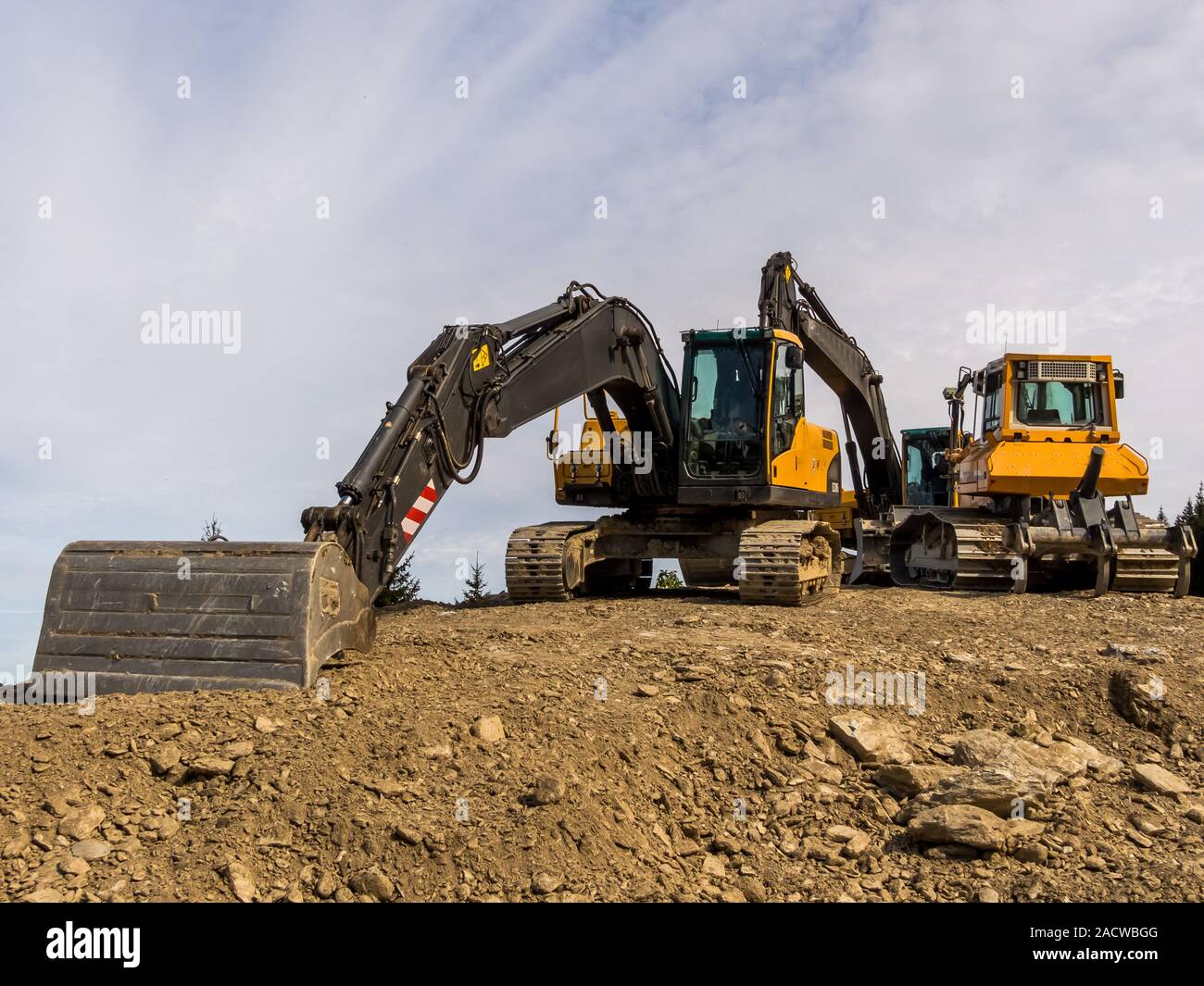 Excavator on a road construction site Stock Photo - Alamy
