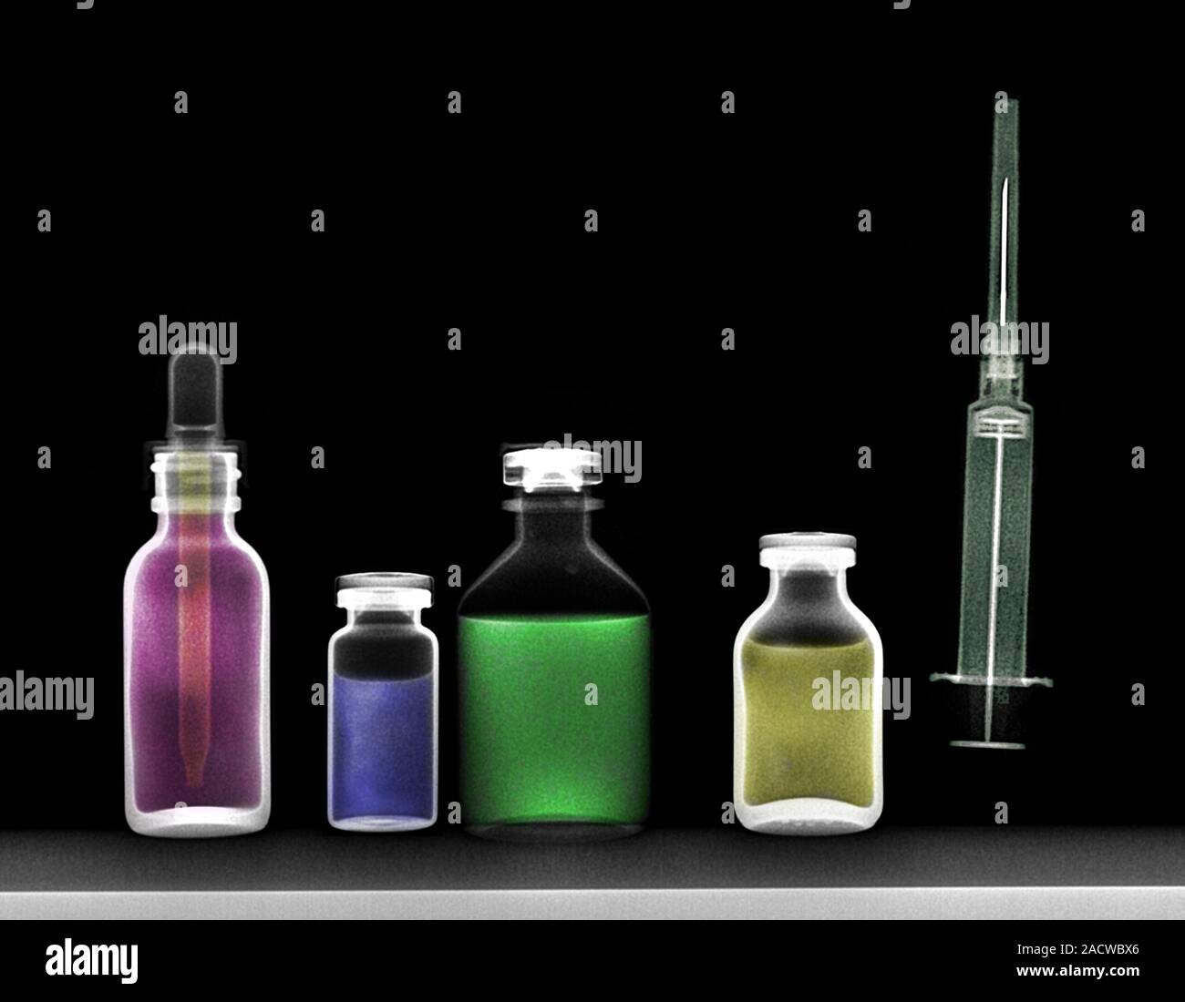 Phials and syringe, coloured X-ray Stock Photo - Alamy