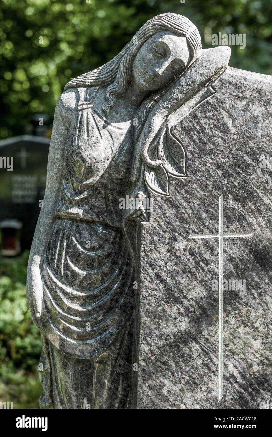 Gravestone with figure Stock Photo - Alamy