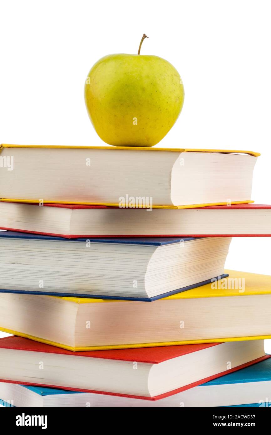 Apple on a stack of books Stock Photo - Alamy