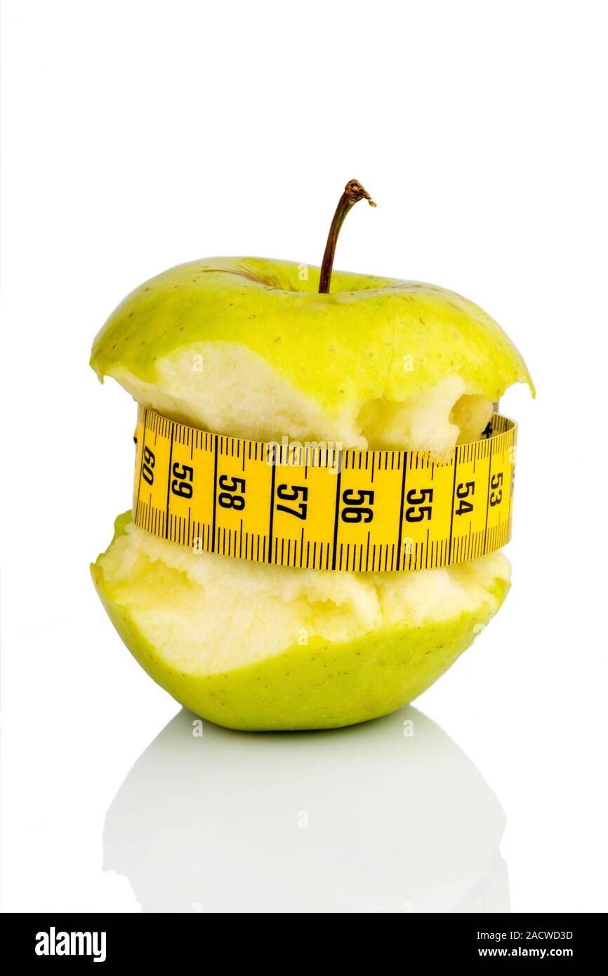 Apple on with tape measure Stock Photo - Alamy