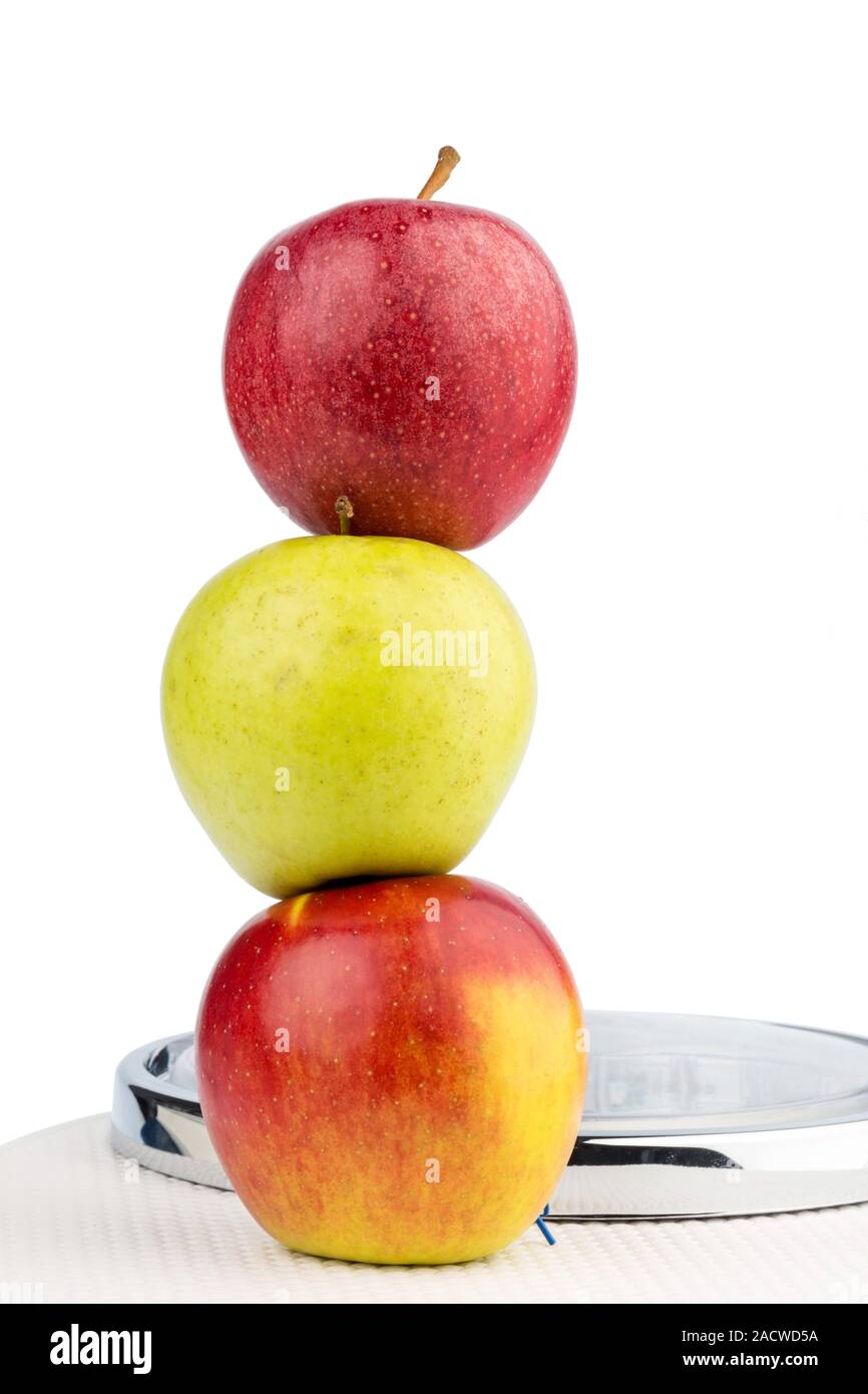 Apples on a scale Stock Photo - Alamy