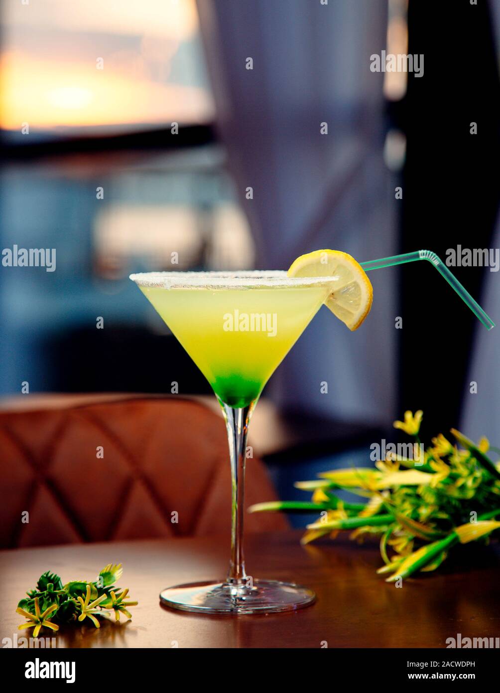 yellow-green alcohol cocktail with salt at the edges Stock Photo - Alamy