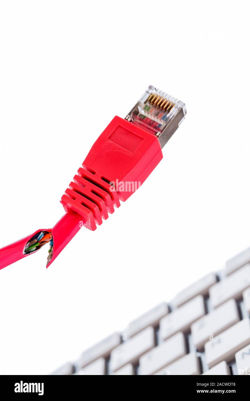 Defective network cable on keyboard Stock Photo - Alamy
