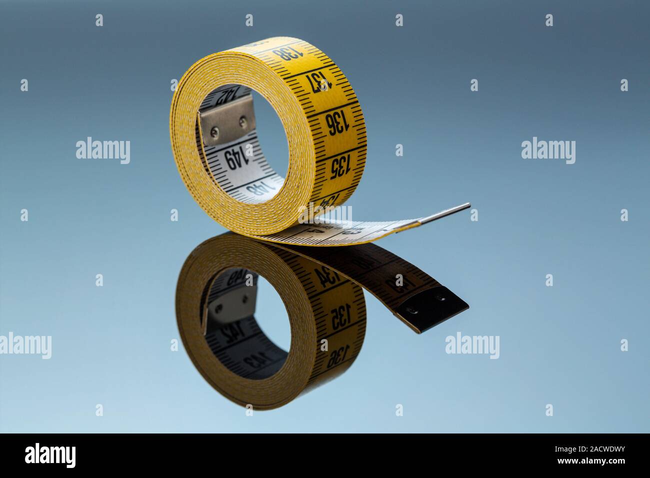 Yellow tape measure Stock Photo - Alamy