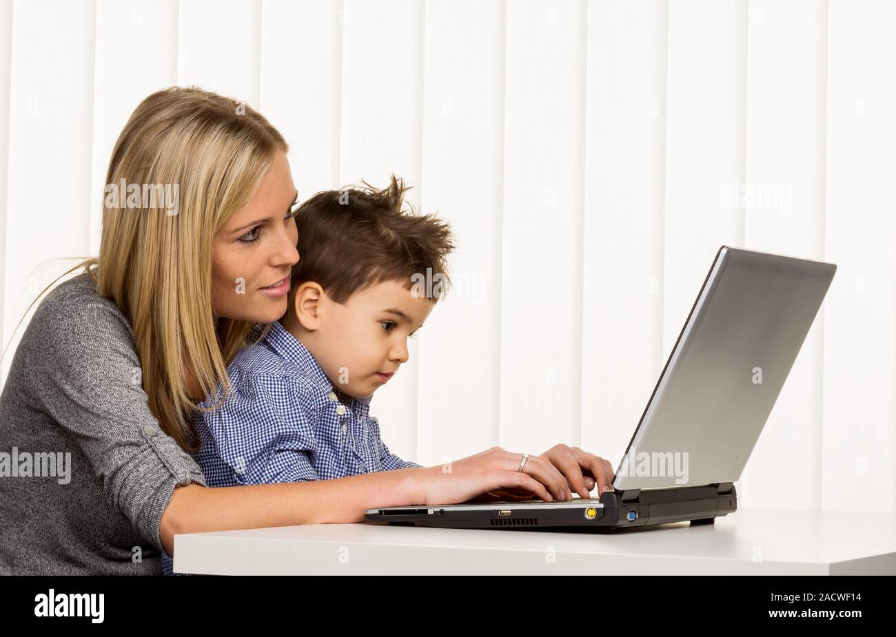 Mother and son at the computer Stock Photo - Alamy