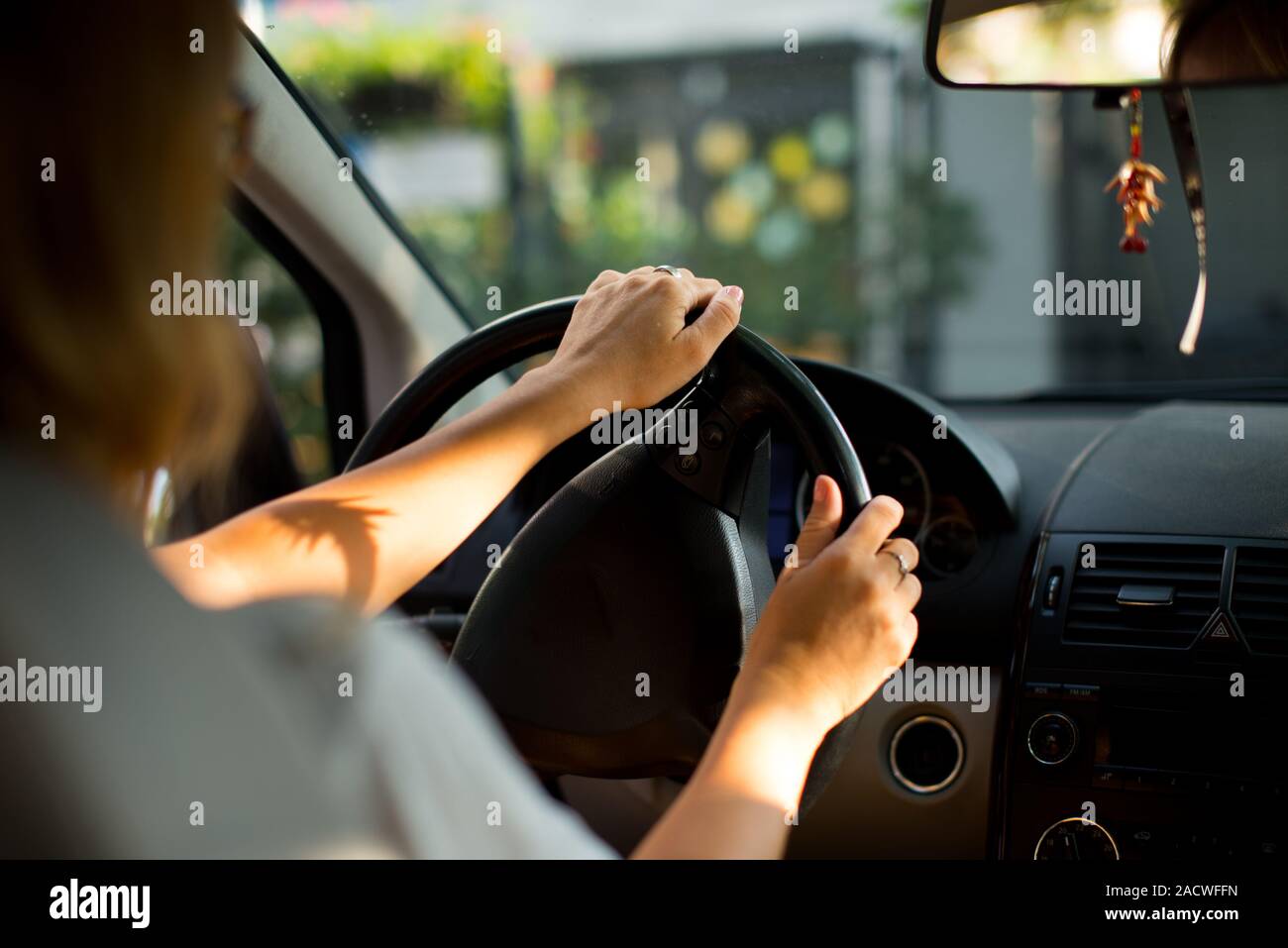 Young beautiful blonde hair girl with driving a car. Confident and ...