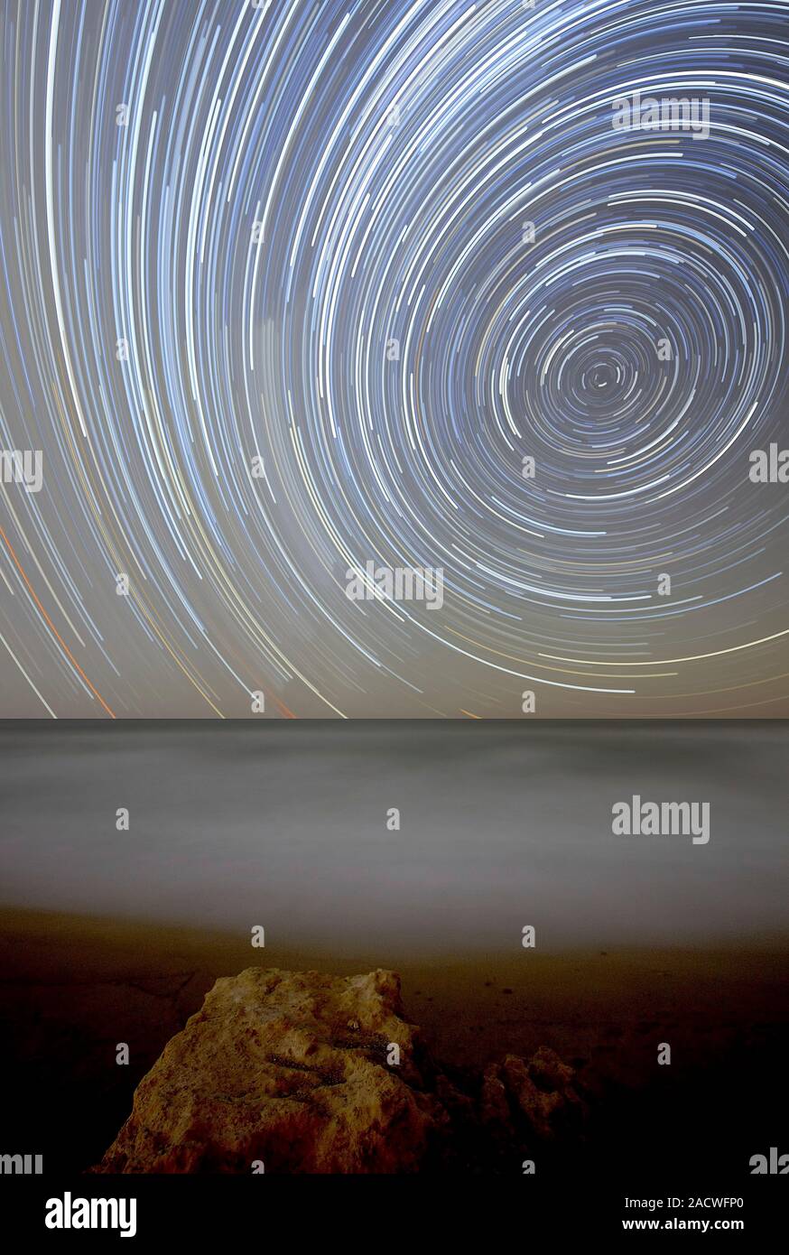 Polar star trails over coastal waters. Time-exposure image of star ...