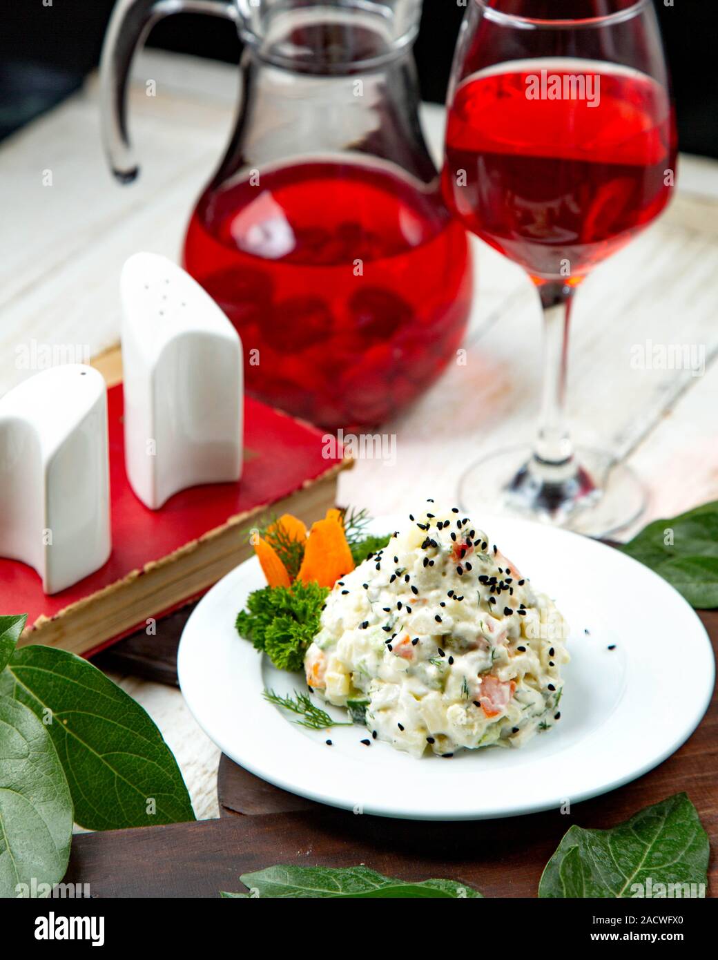 capital salad and a glass of compote Stock Photo - Alamy