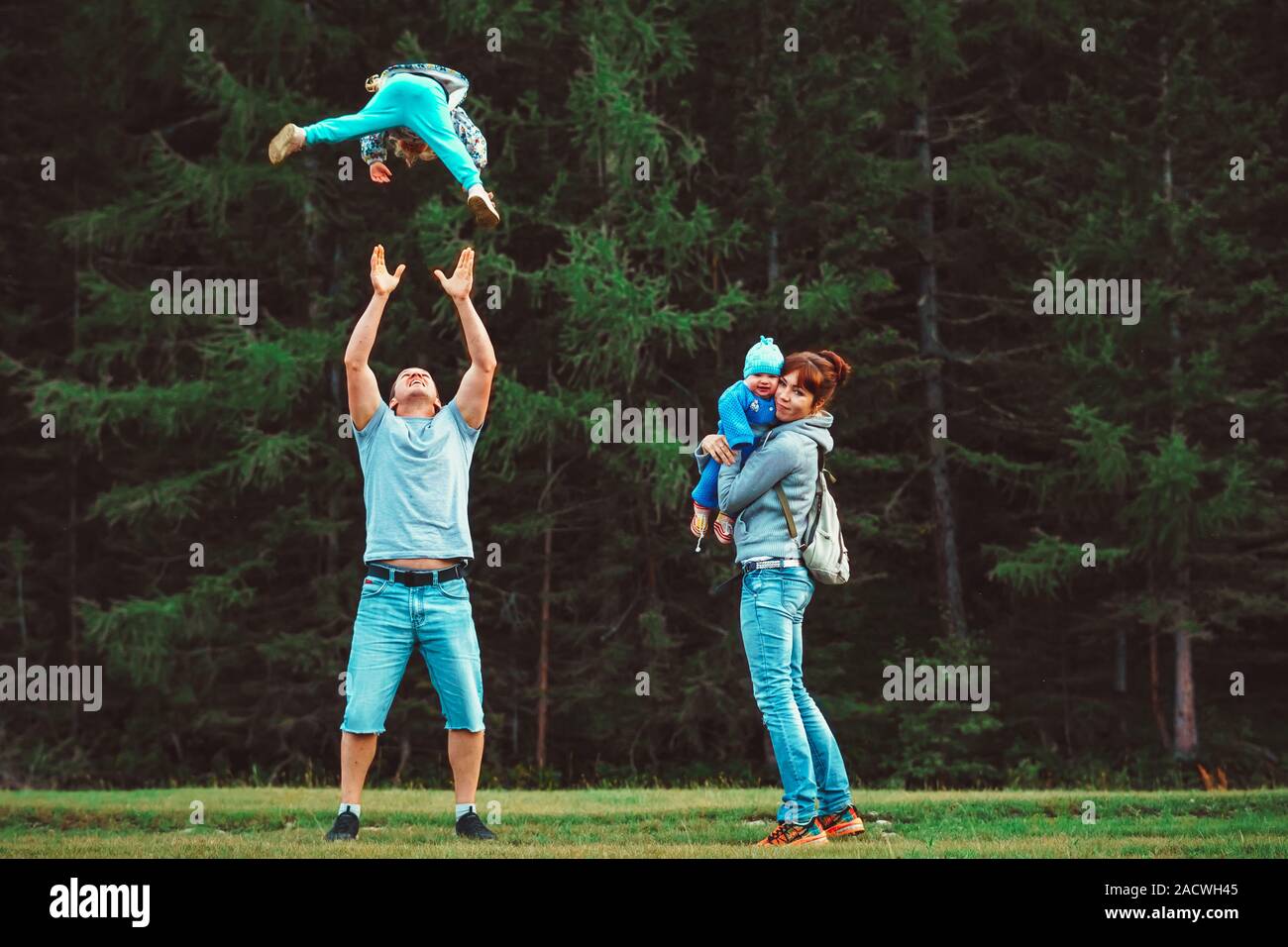 young family with children playing near the forest Stock Photo - Alamy