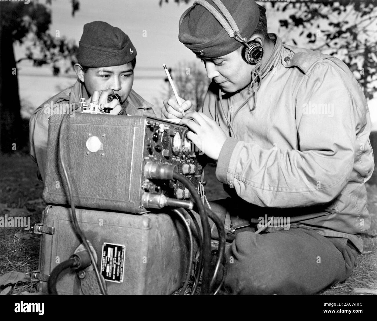 Navajo code talkers. Navajo Indian Marines using a field radio in the ...