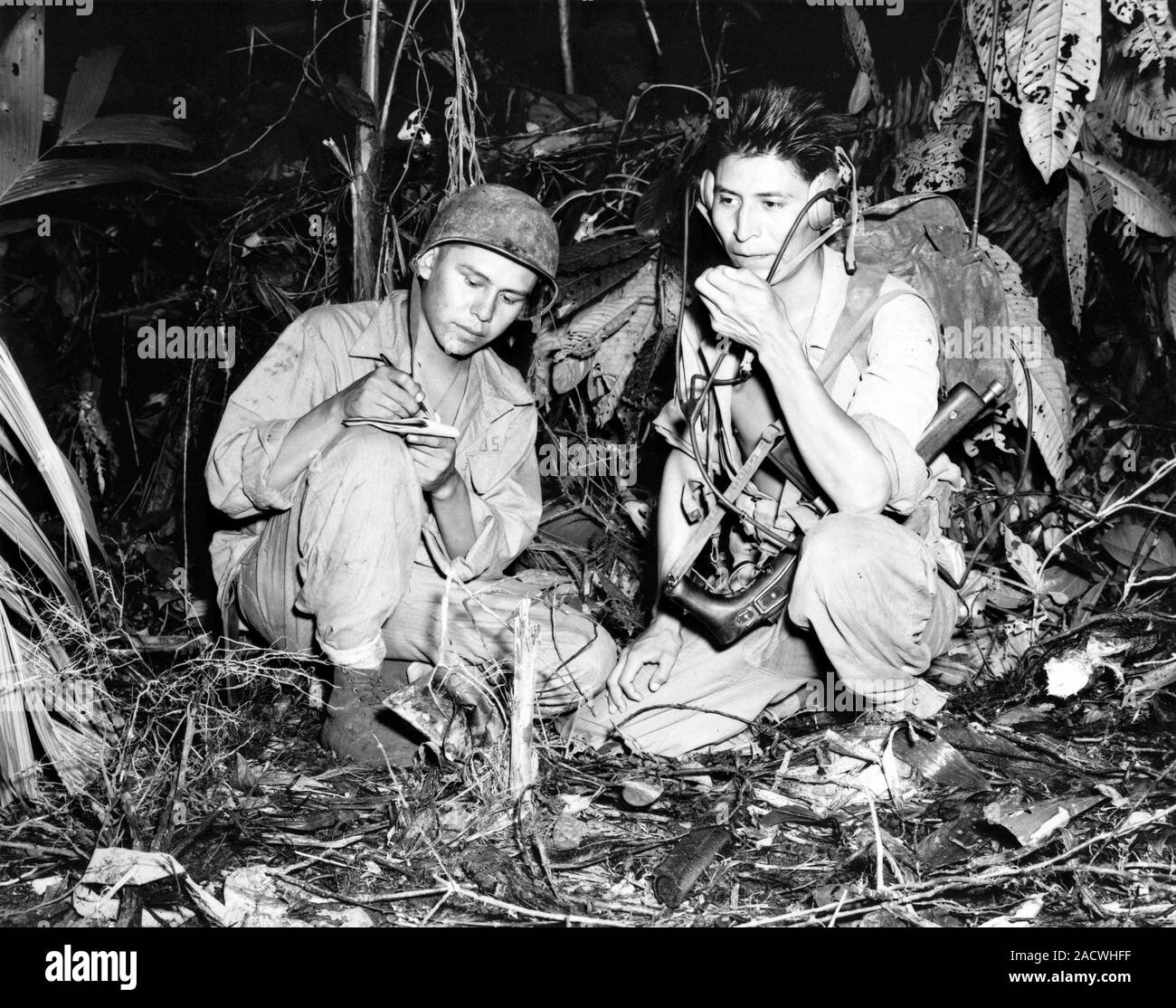 Navajo code talkers. Navajo Indian Marines using a field radio on the ...