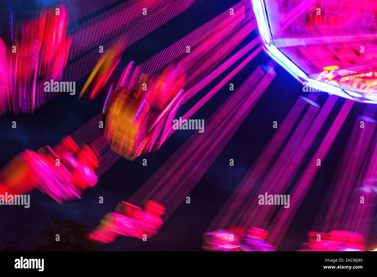 Traditional chain carousel at night Stock Photo - Alamy