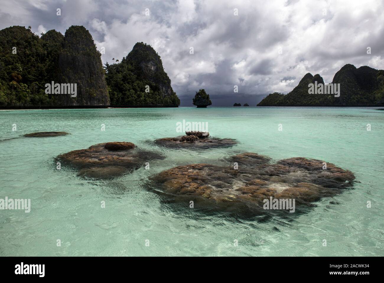 Rain clouds approaching a set of limestone islands and the lagoon they ...