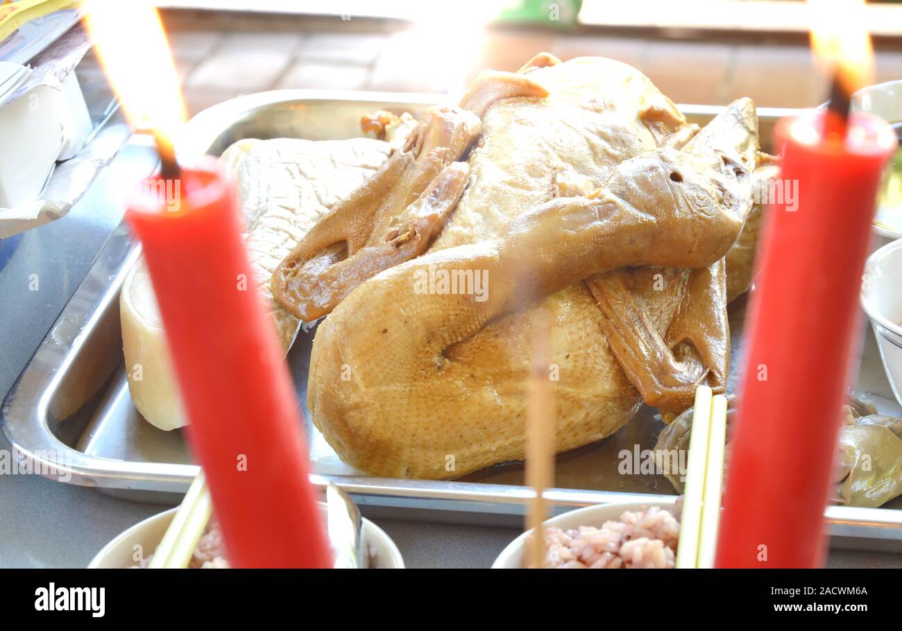 red candle and incense stick fire for offering god with ancestor in ...