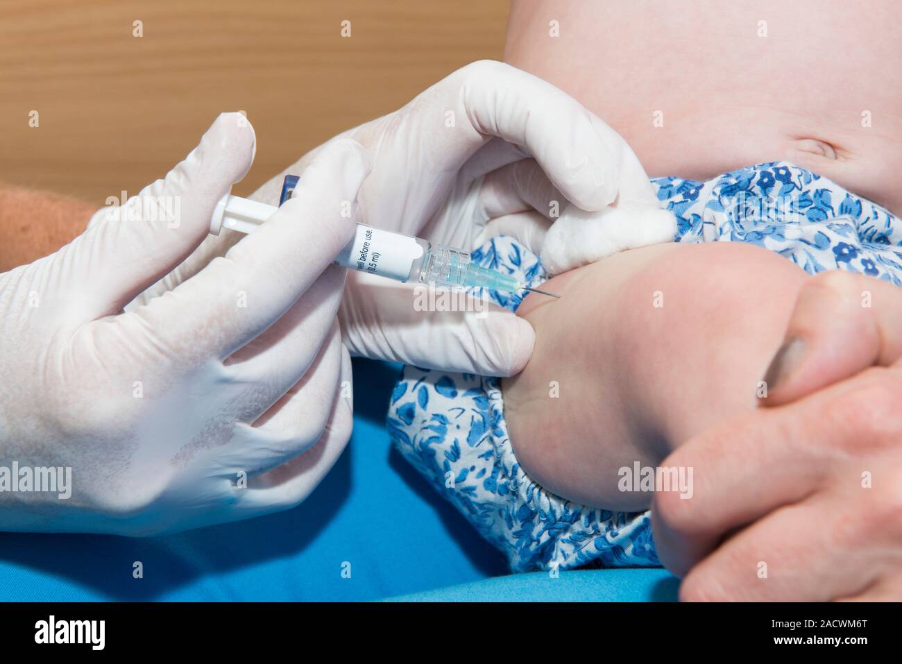 Pediacel vaccine being given to an infant. Pediacel vaccinates against ...