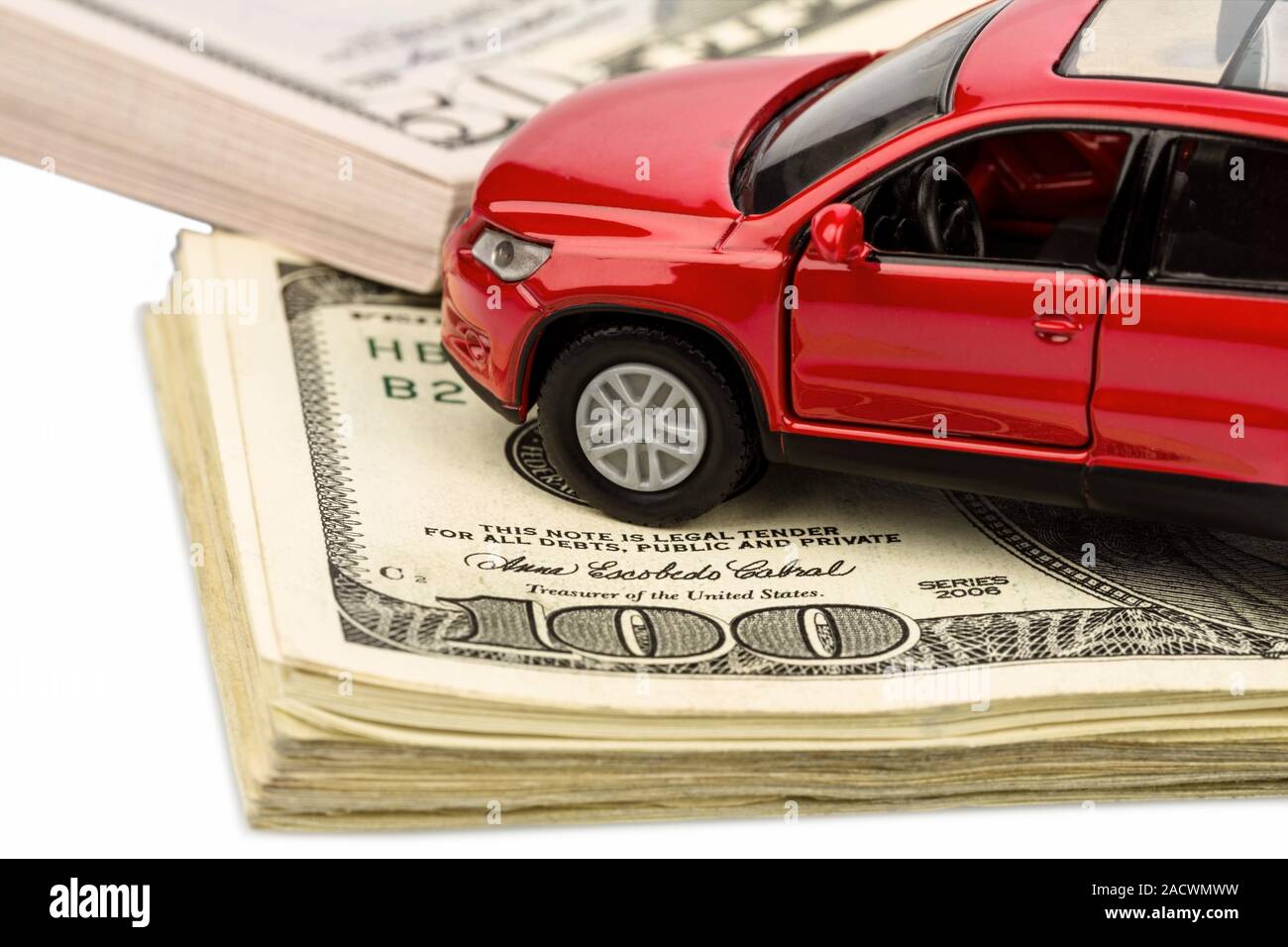 Car on dollar banknotes Stock Photo - Alamy