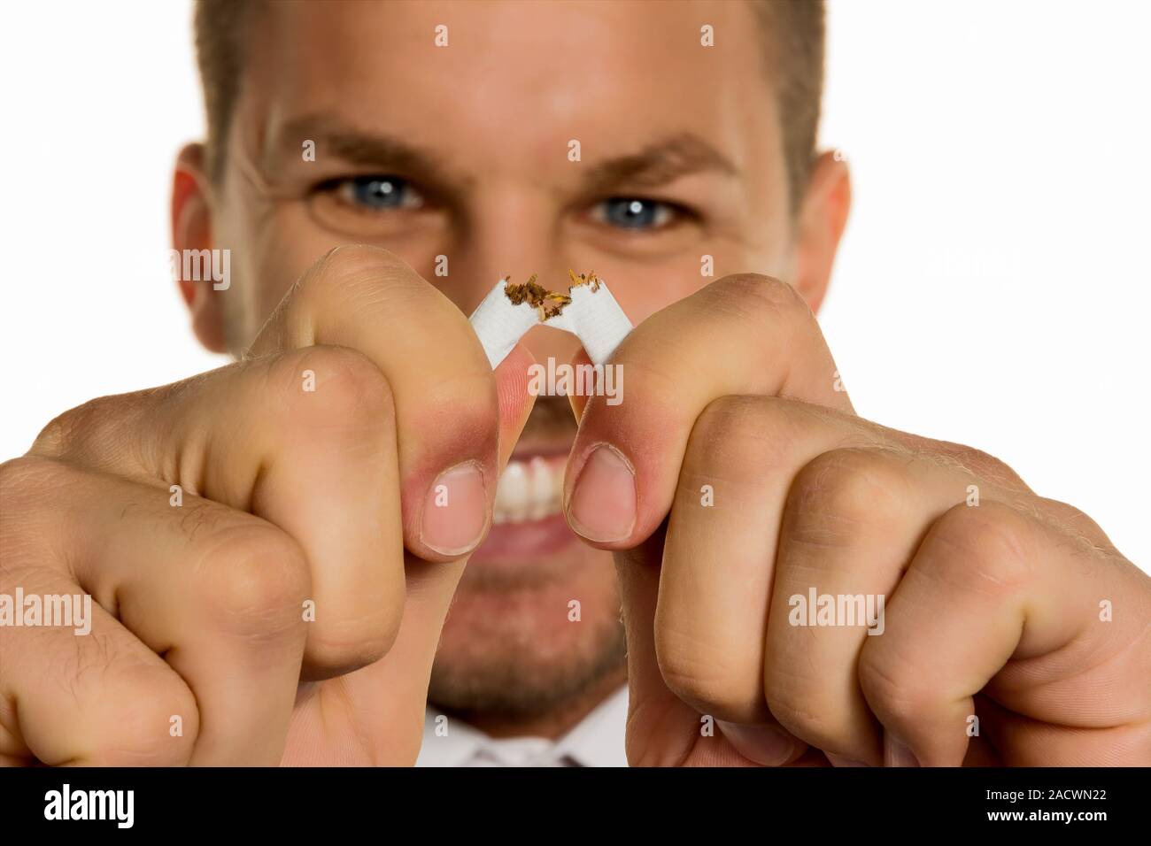 Man breaks cigarette Stock Photo - Alamy