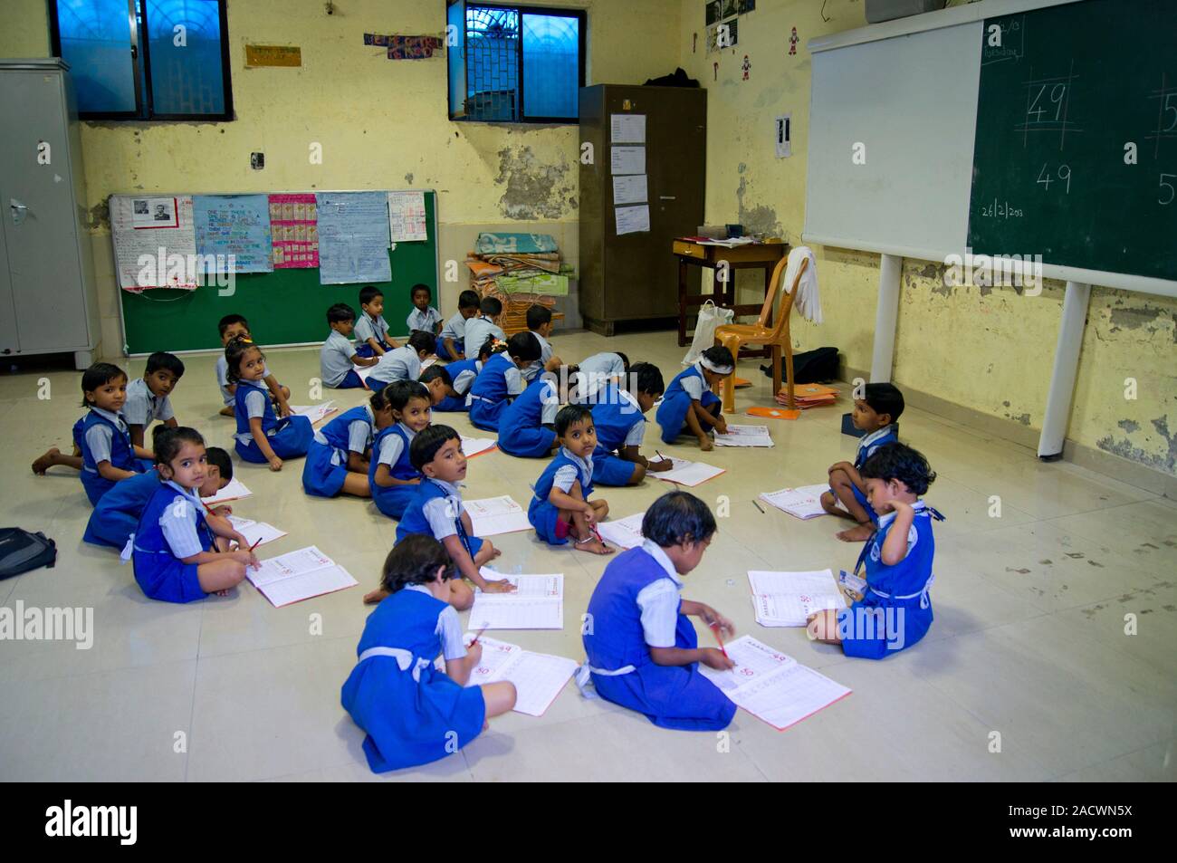 Classroom in a primary school in the Dharavi slum area of Mumbai, India ...