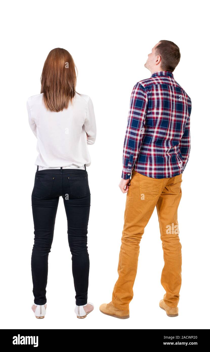 Back view of couple. beautiful friendly girl and guy together. Rear ...