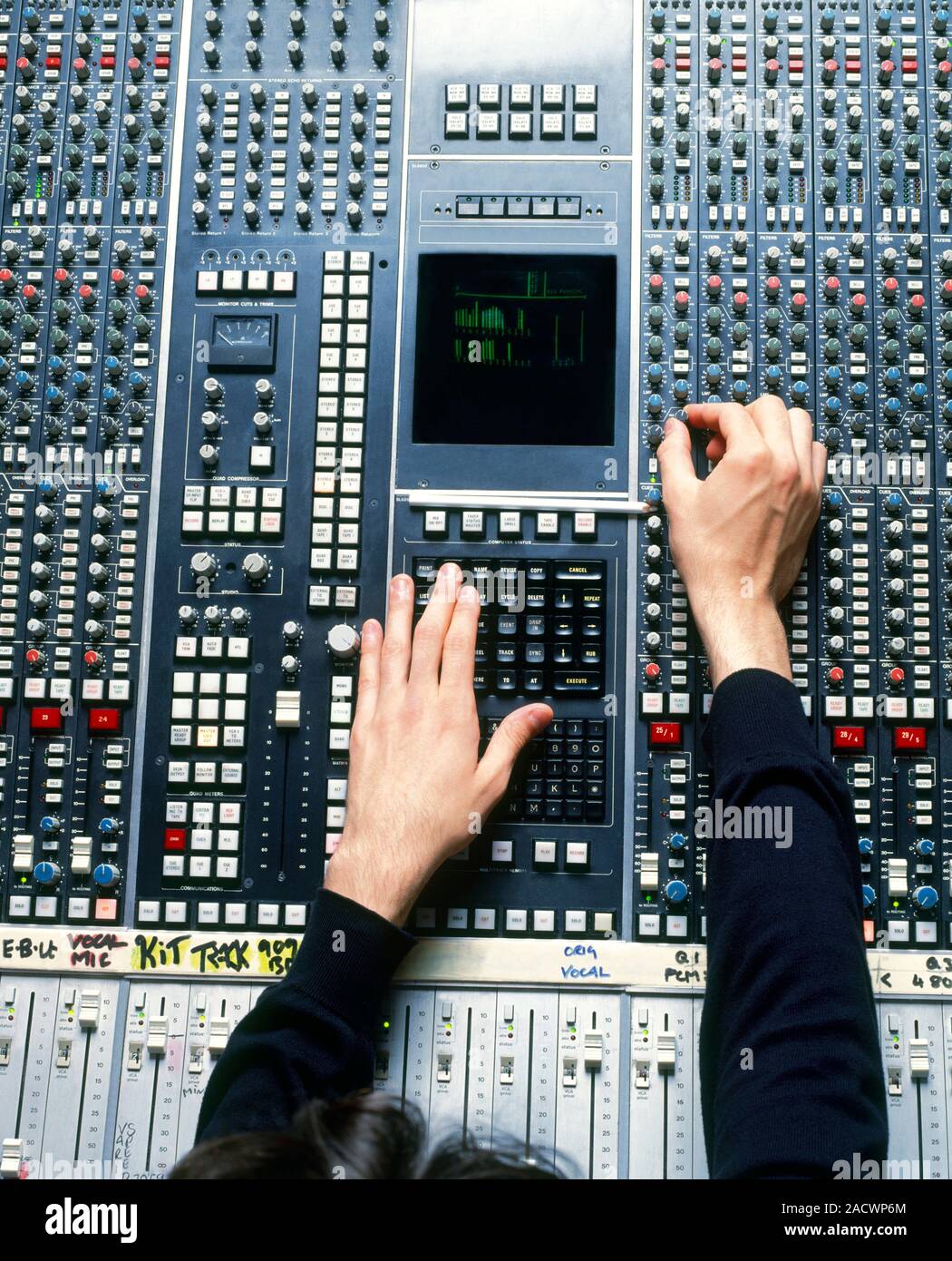 Man operating recording desk Stock Photo - Alamy
