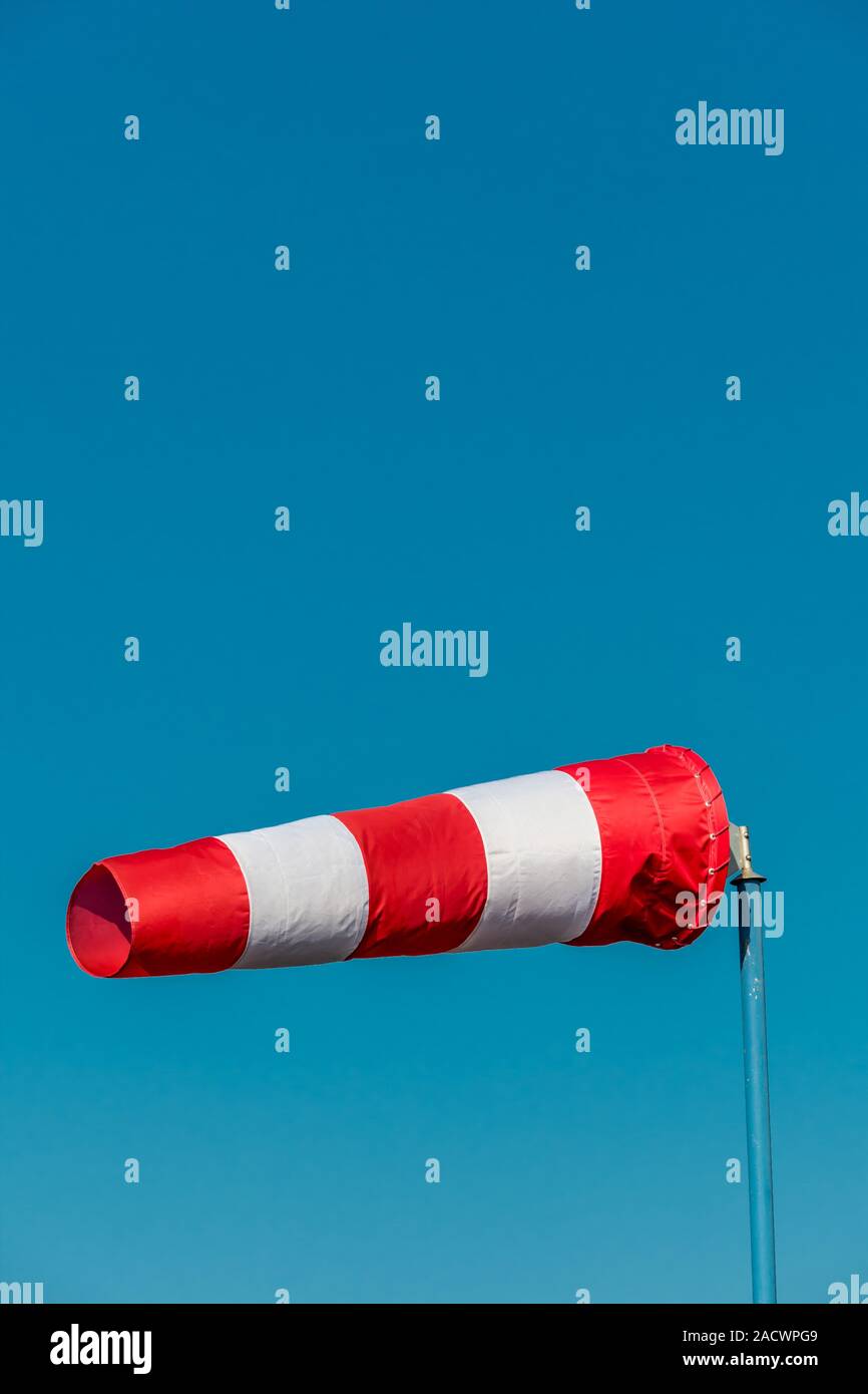 Windsock in front of blue sky Stock Photo - Alamy