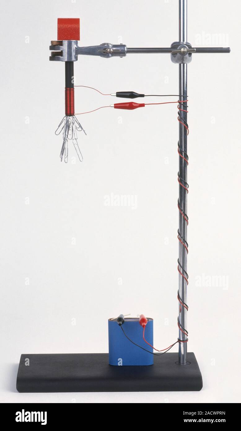 Electromagnetic experiment using battery connected to wires, clamp ...