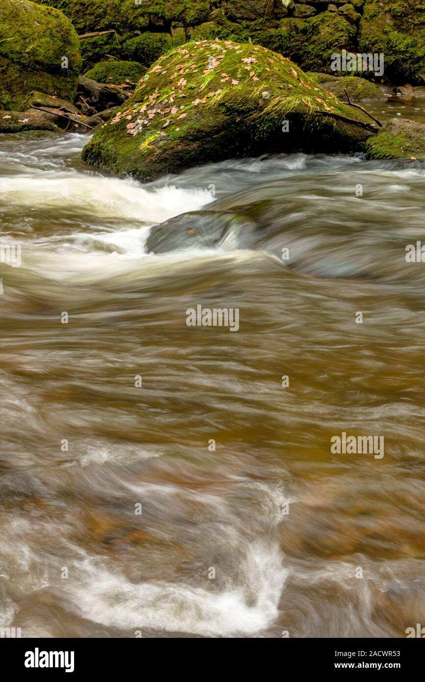 Stream with stone Stock Photo - Alamy