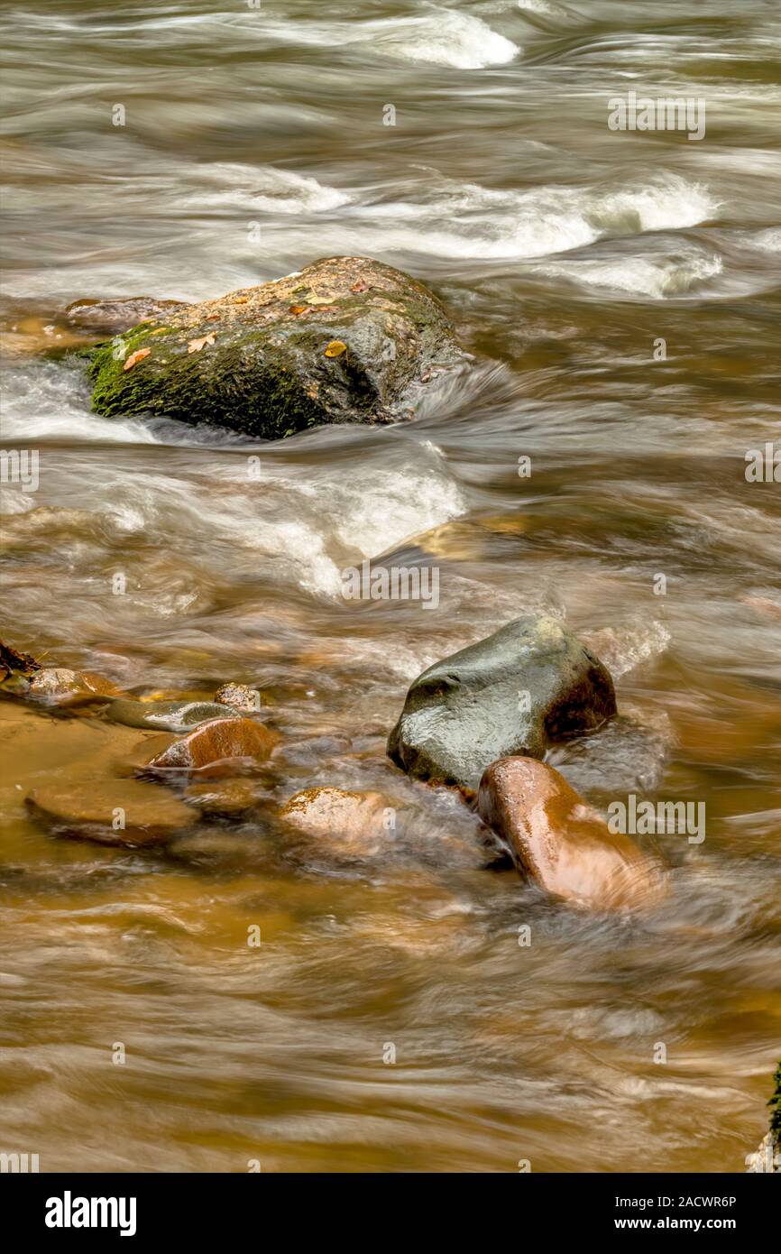 Stream with stone Stock Photo - Alamy