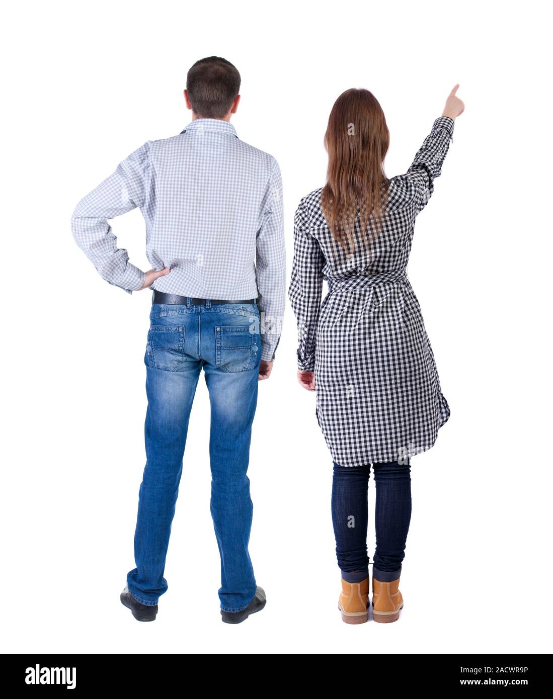 Back view of a stylish couple pointing. beautiful friendly girl and guy ...