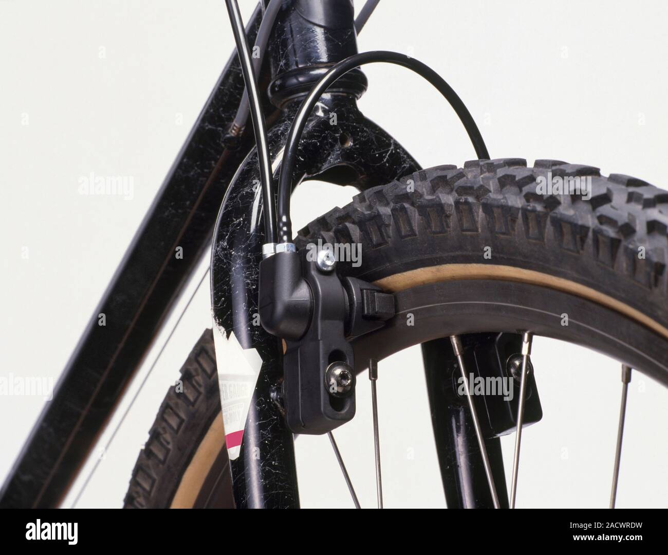 Close-up of hydraulic brake on front wheel of bicycle Stock Photo - Alamy