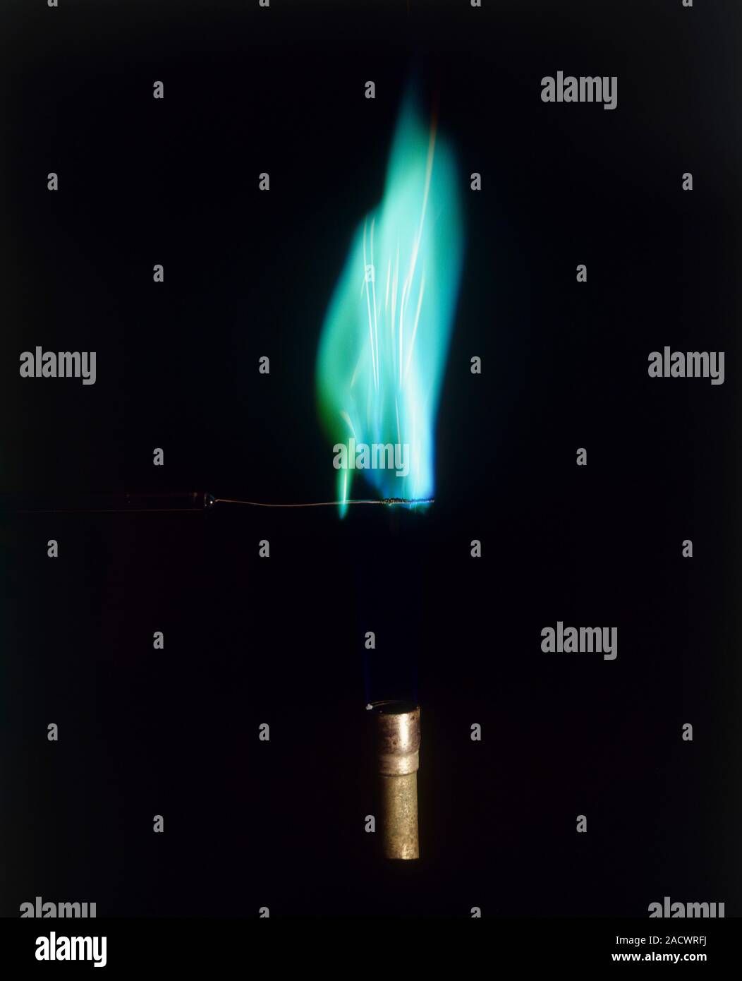 Copper compound burning with green-blue flame Stock Photo - Alamy