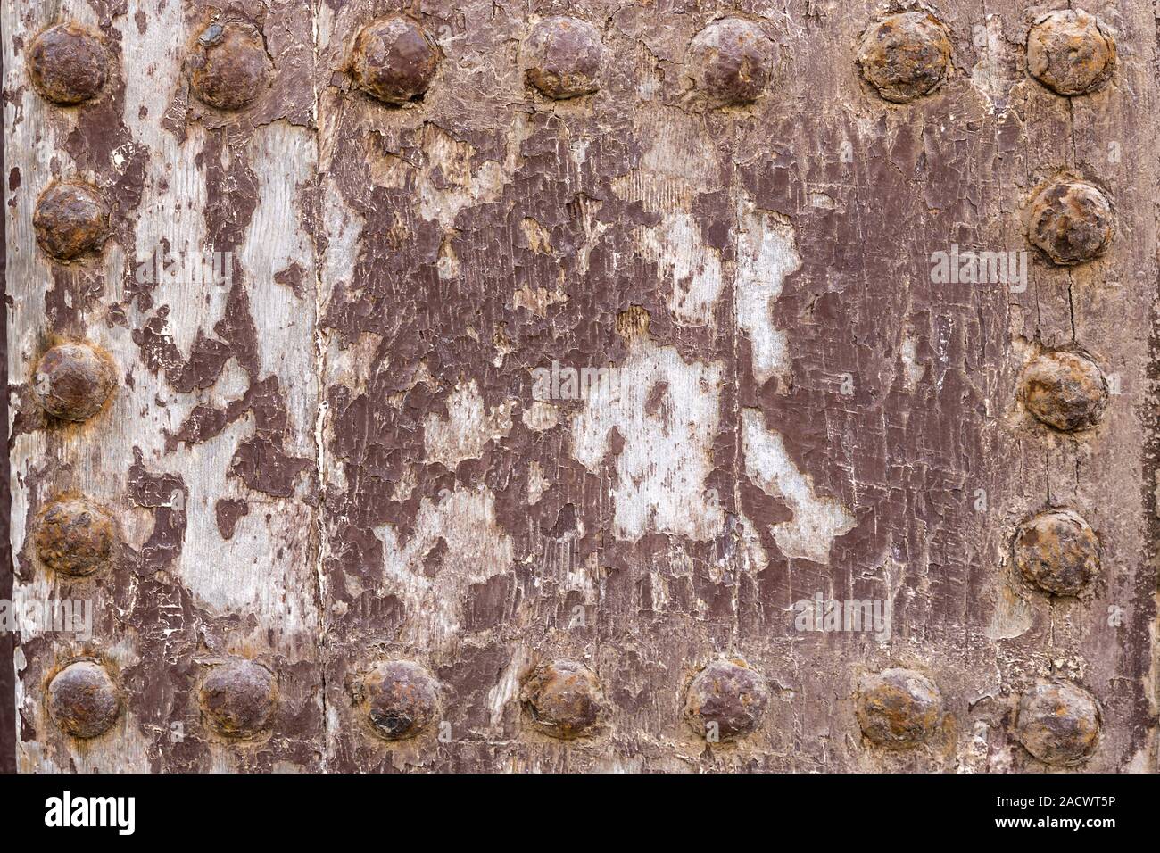 Wooden panel with rivets and weathered coating Stock Photo - Alamy