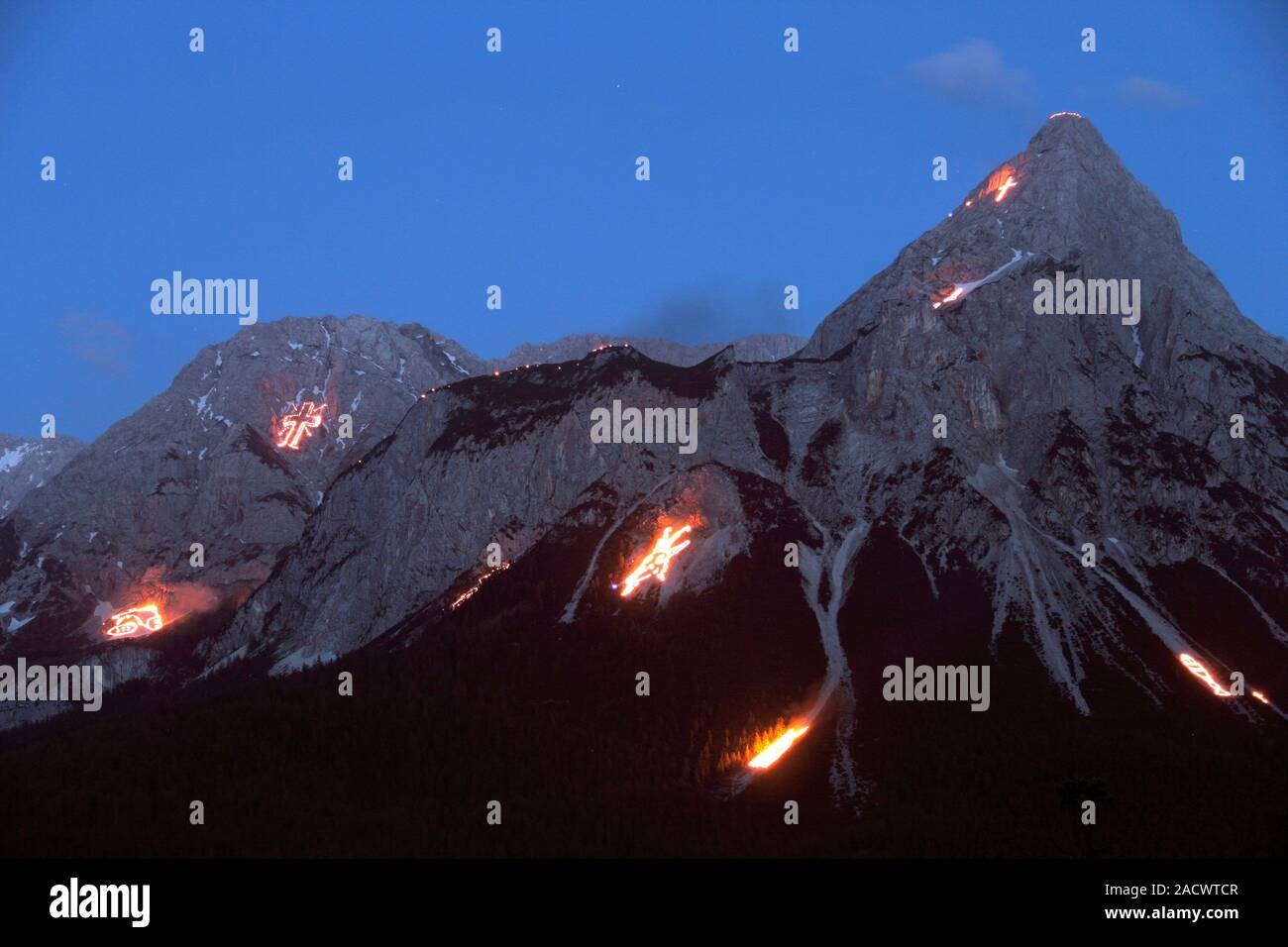 Solstice celebrations. Mountain fires in Ehrwald, Tyrol, Austria, as ...