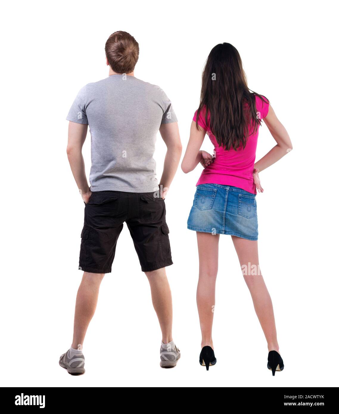 Back view of couple. beautiful friendly girl and guy together. Rear ...