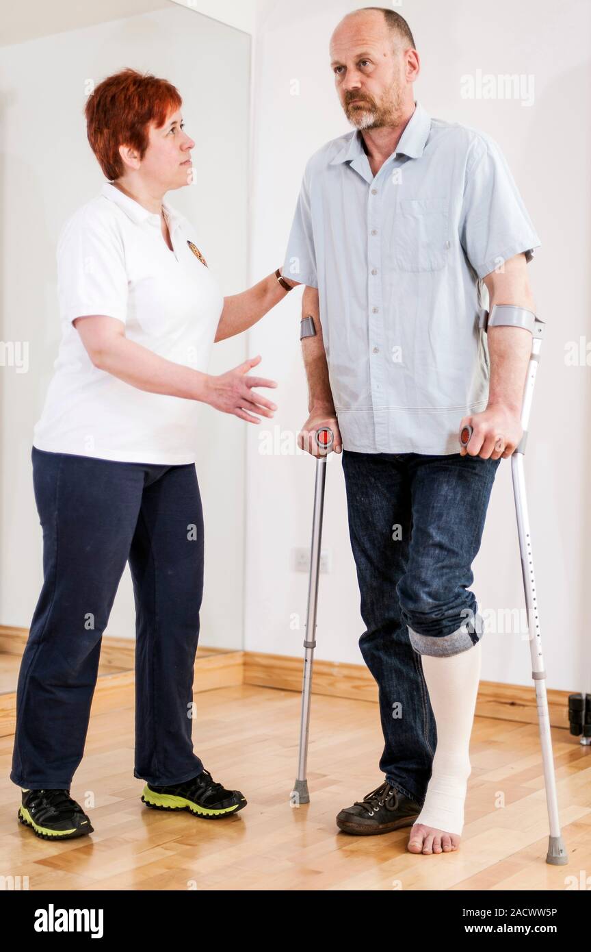Physiotherapy session. Physiotherapist working with a patient who is ...