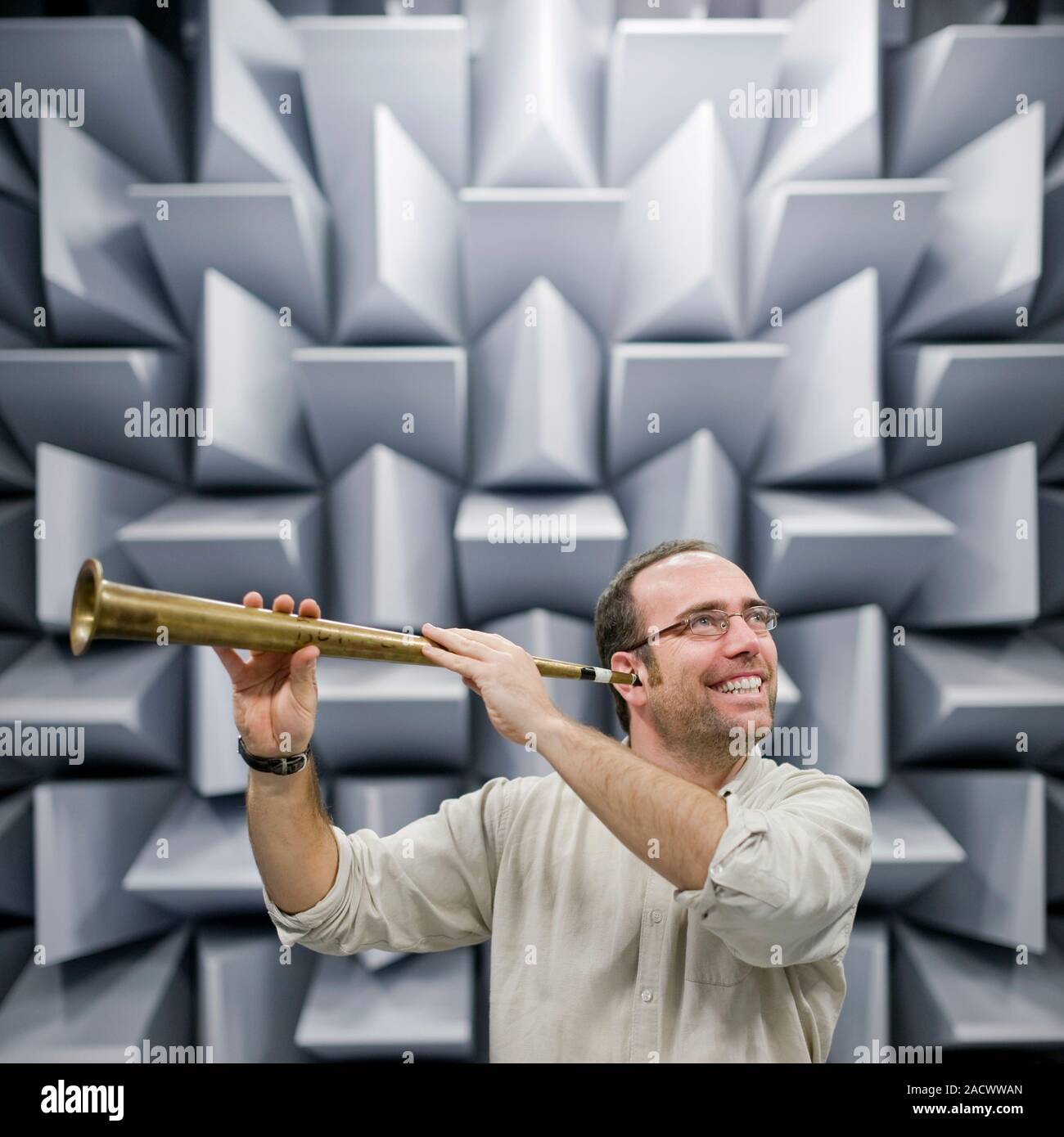 Vincent Tournat, French physicist, using an ear trumpet in an anechoic ...