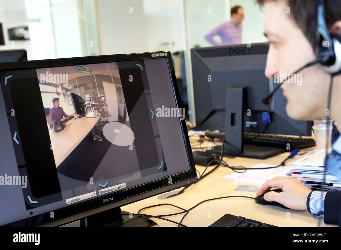 Telepresence office robot operation. Officer worker operating a ...